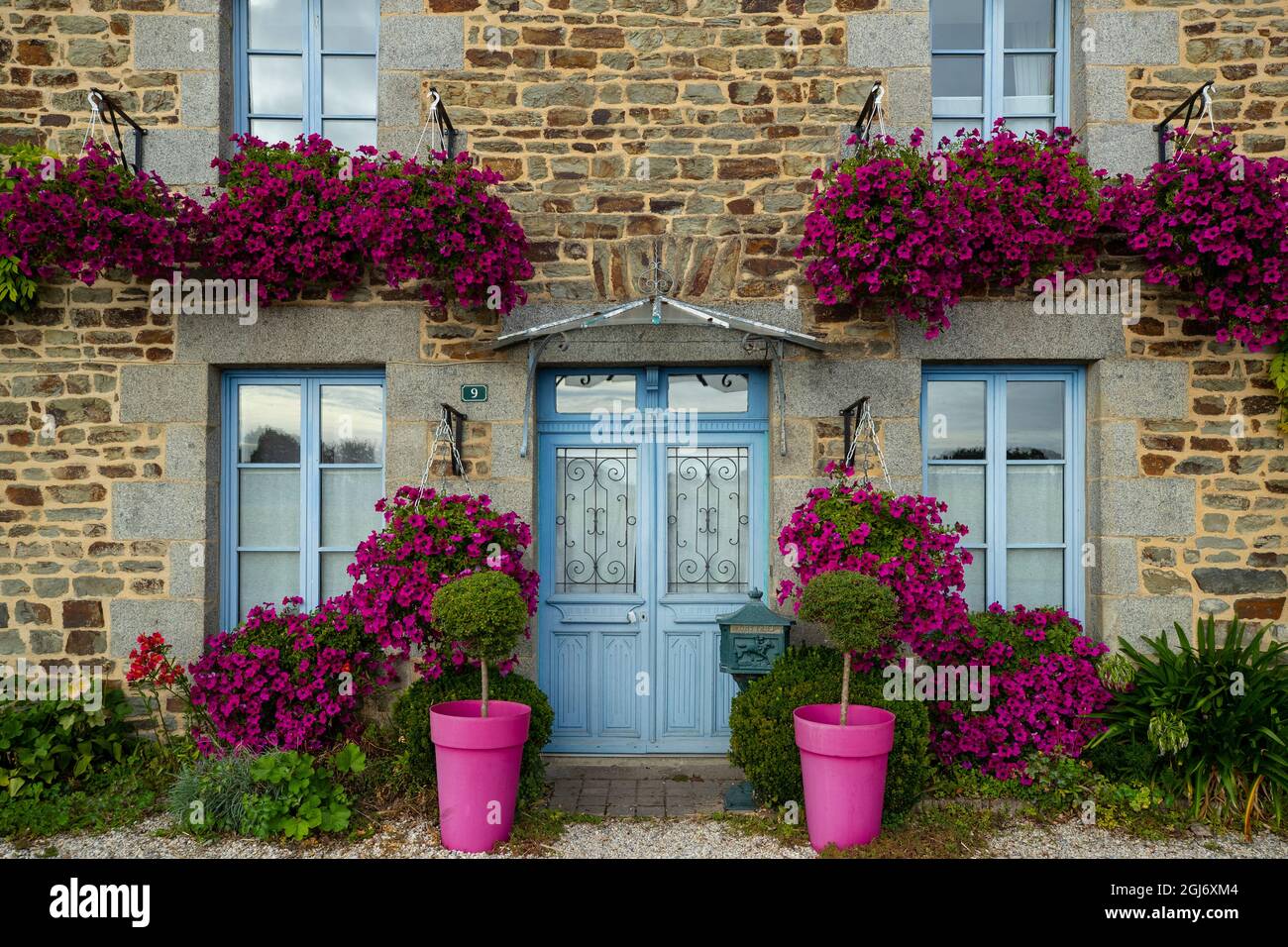Europe, France, Normandy. Flower-decorated house exterior Stock Photo ...