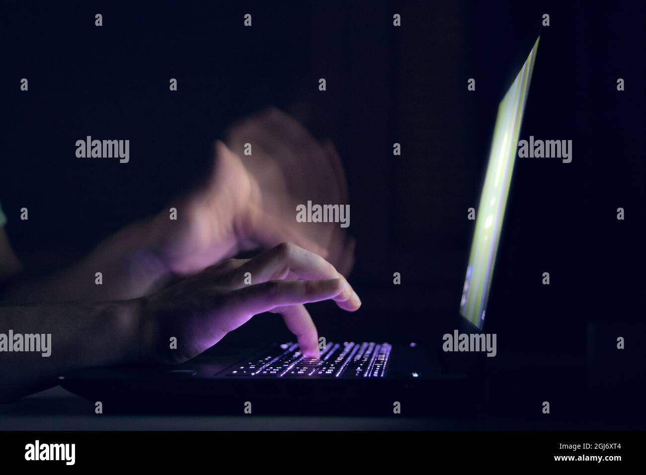 Side view of a person quickly and angrily typing on the keyboard Stock ...