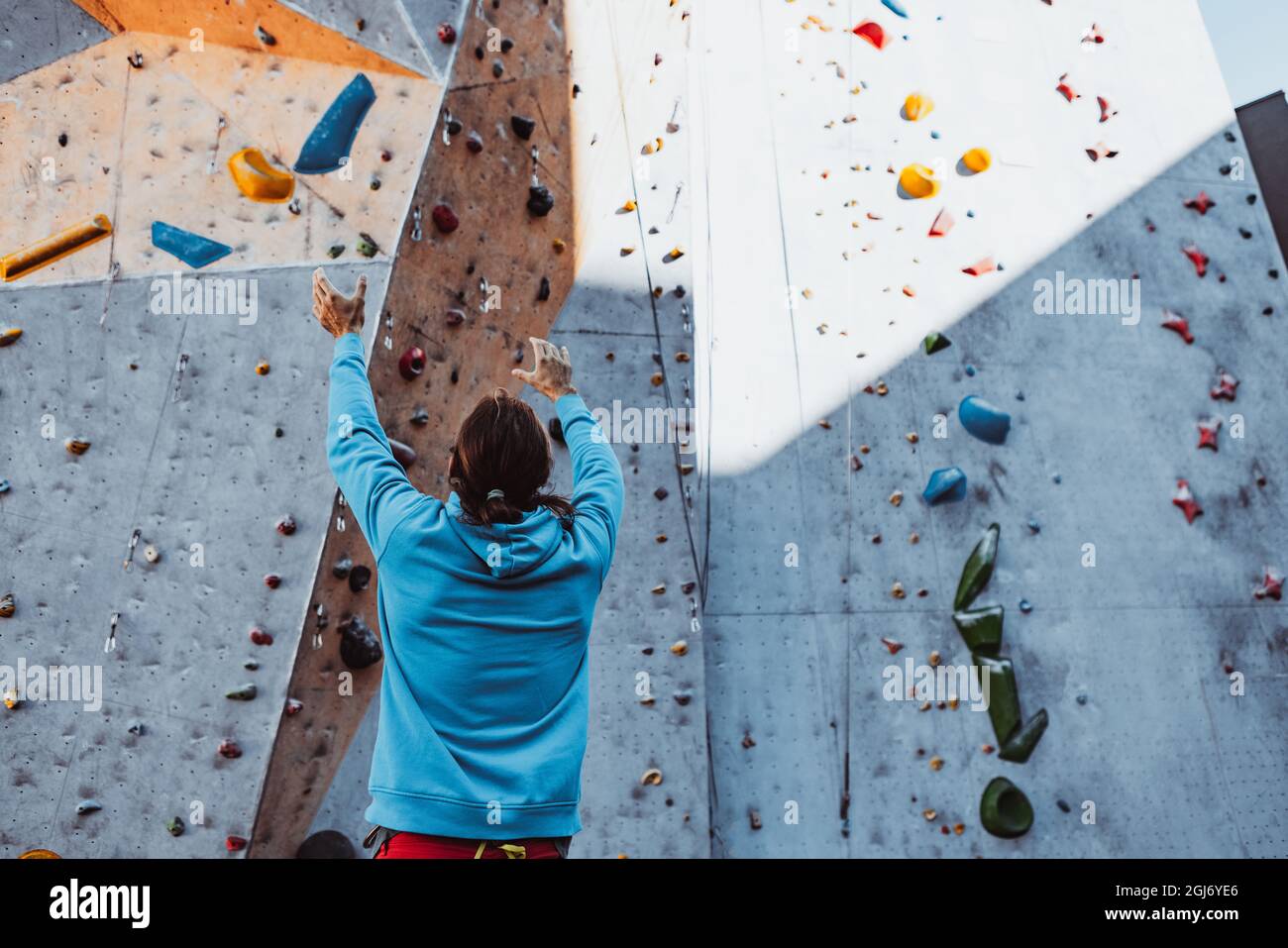 Safety climbing. Young man professional rock climber checking sports ...