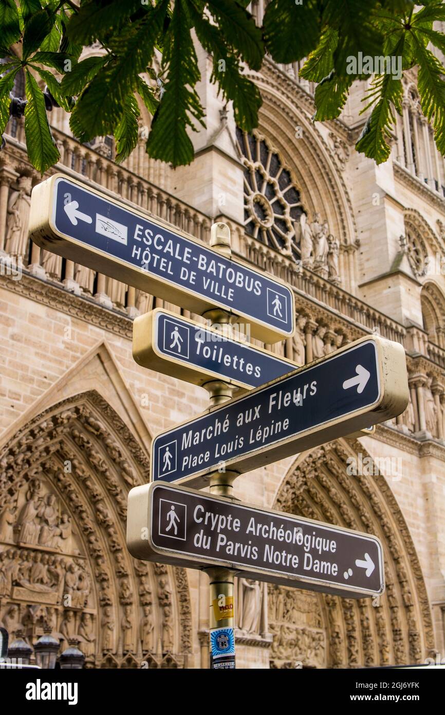 Signpost next to pre-fire Notre Dame Cathedral, Paris, France Stock ...
