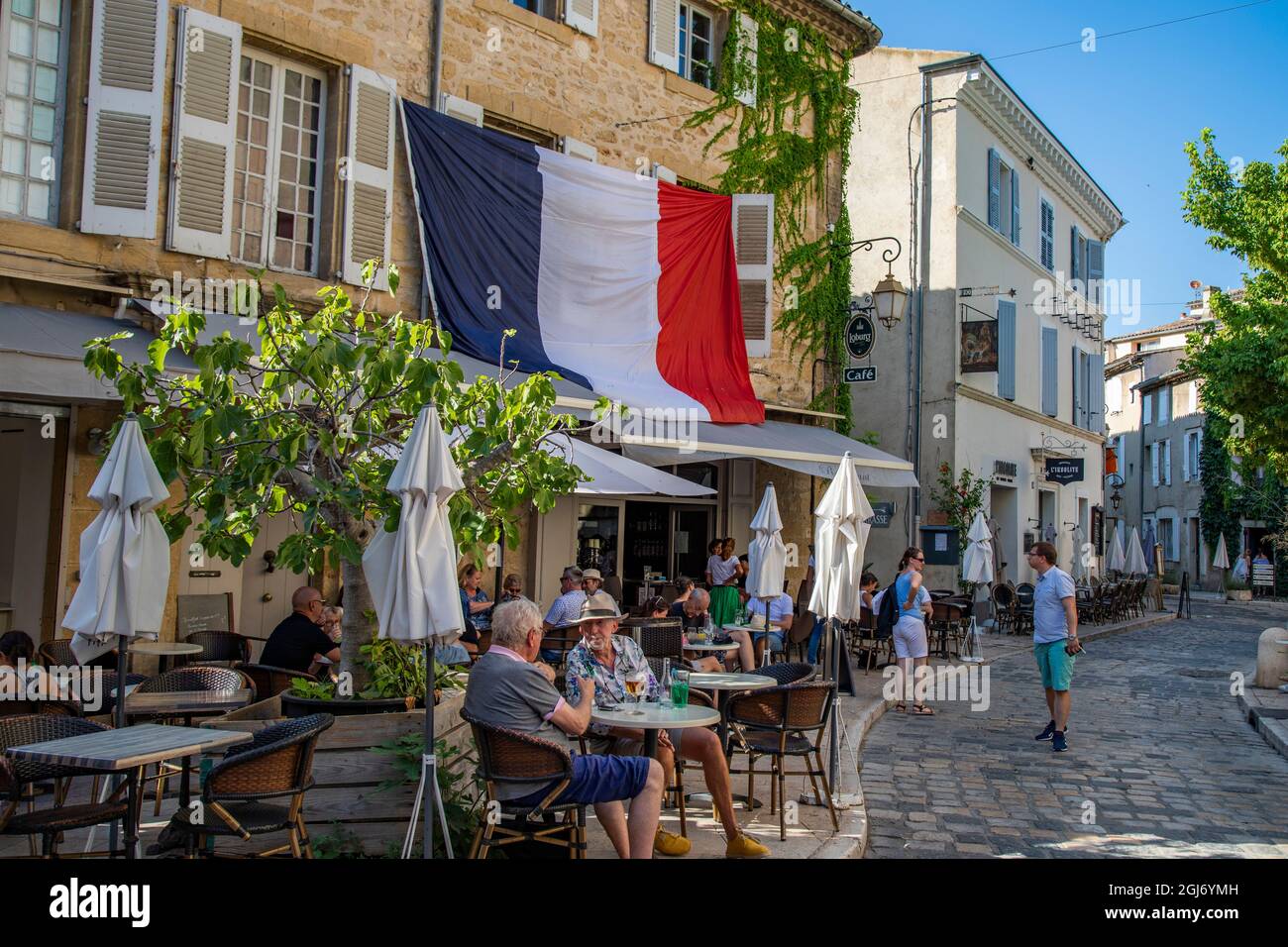 Small French village cafes with French flag in Provence region of ...