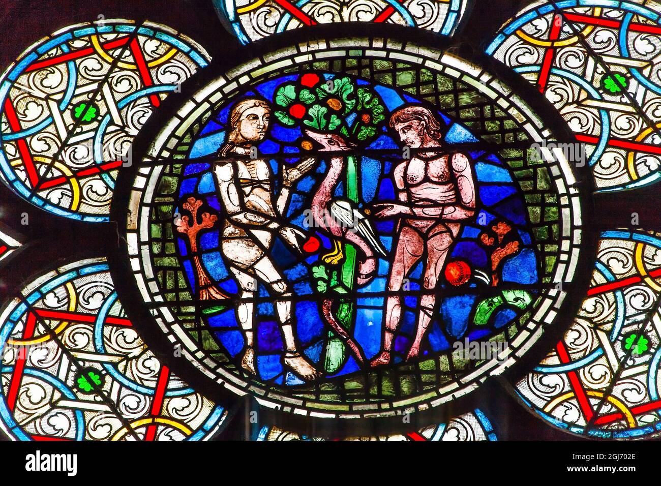 Adam Eve stained glass, Notre Dame Cathedral, Paris, France. Notre Dame was built between 1163 ...