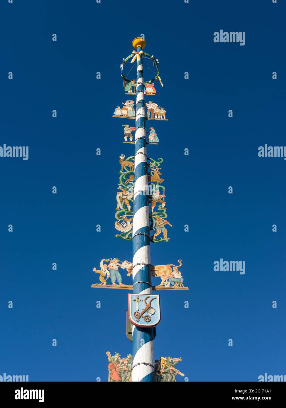 Traditional Bavarian maypole (Maibaum). Village Schliersee in the ...