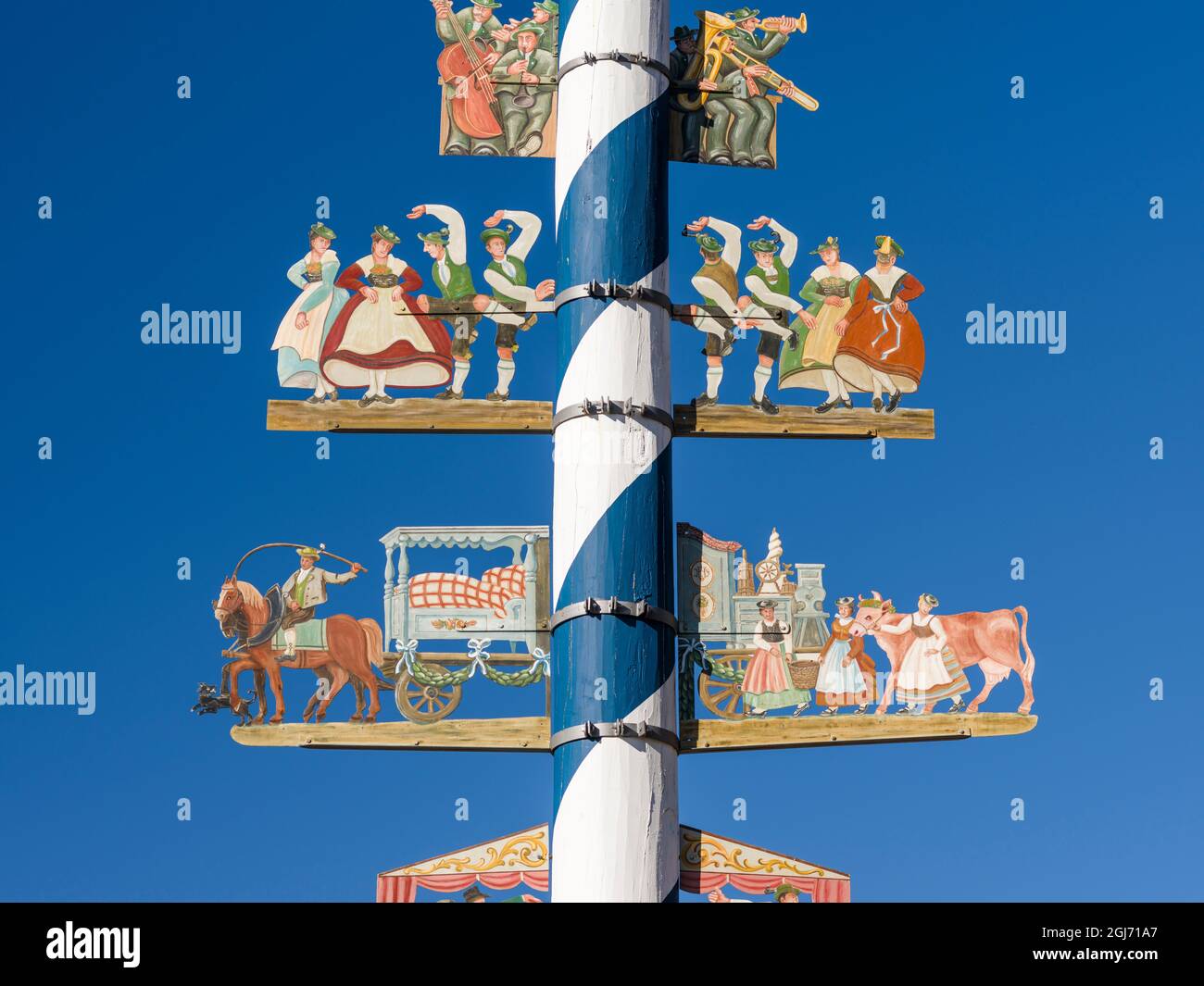 Traditional Bavarian maypole (Maibaum). Village Schliersee in the ...