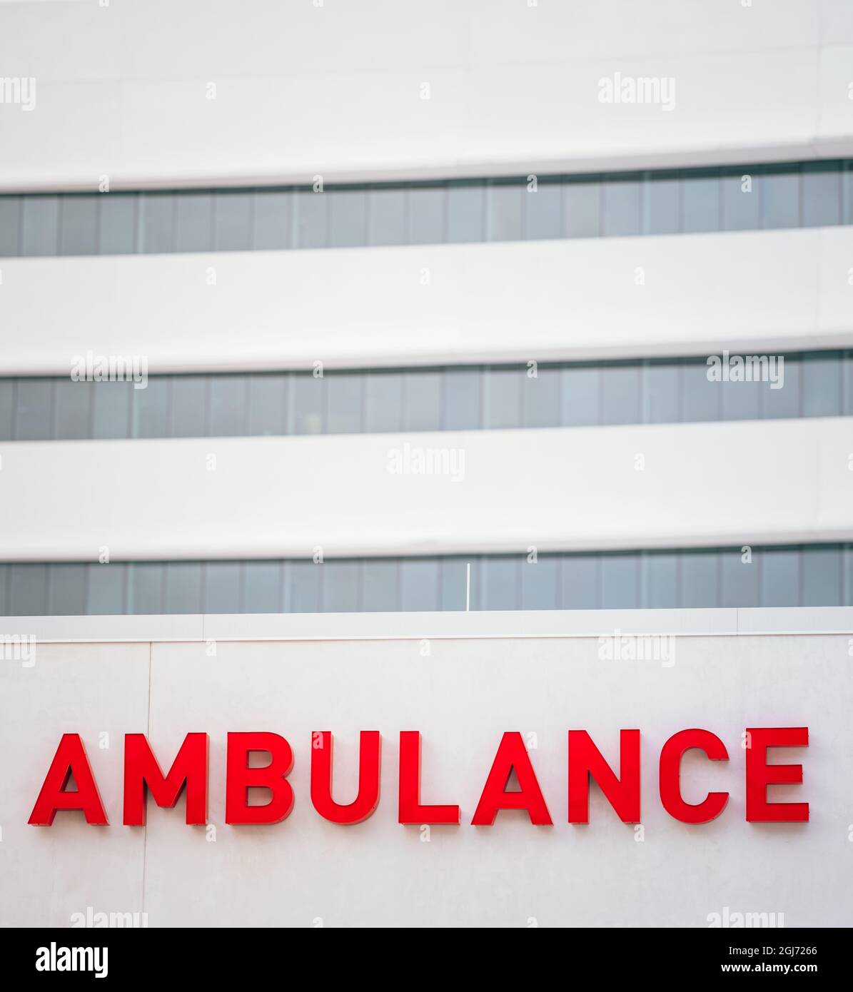 Red AMBULANCE sign on a building Stock Photo - Alamy