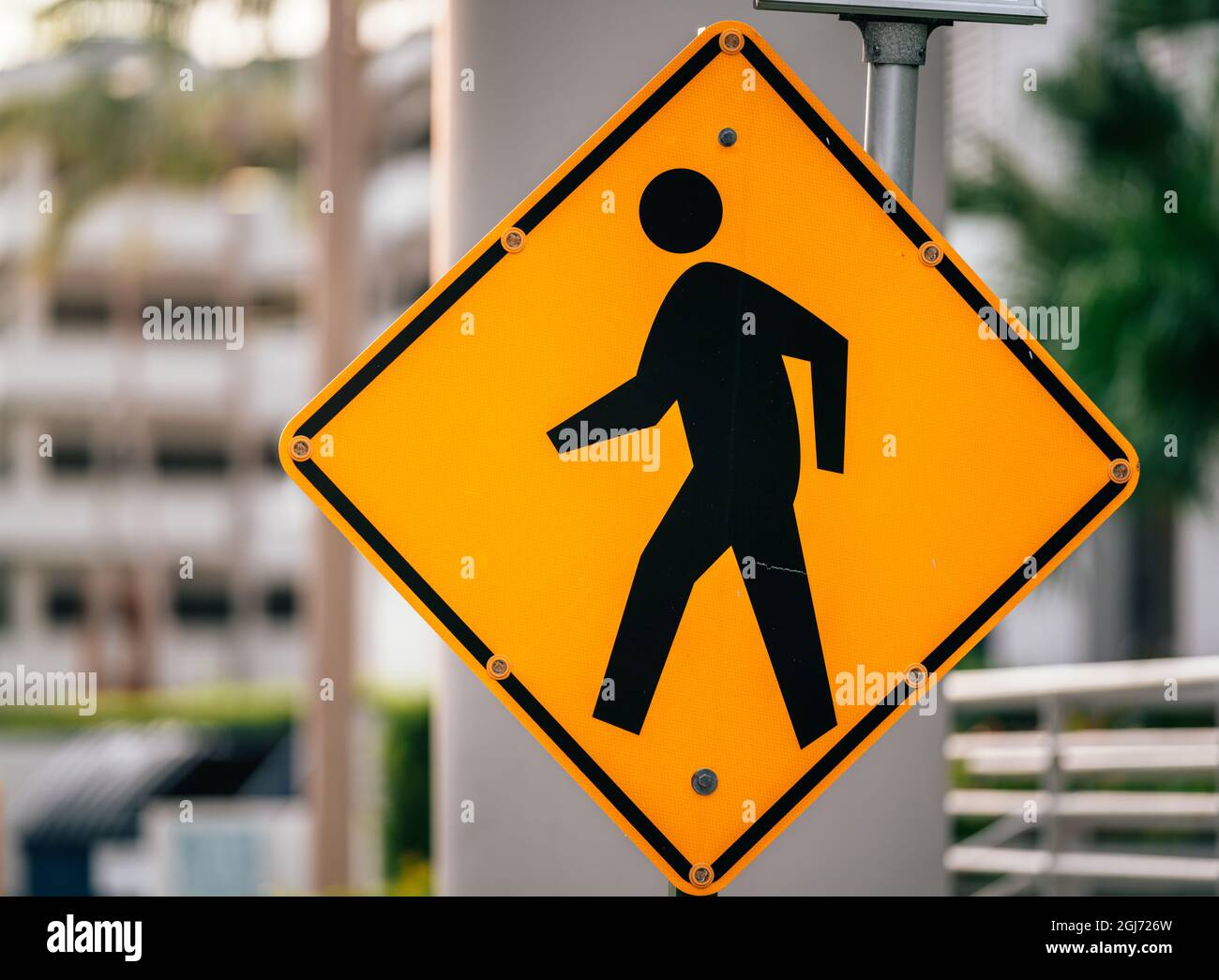 Yellow pedestrian crossing sign Stock Photo - Alamy