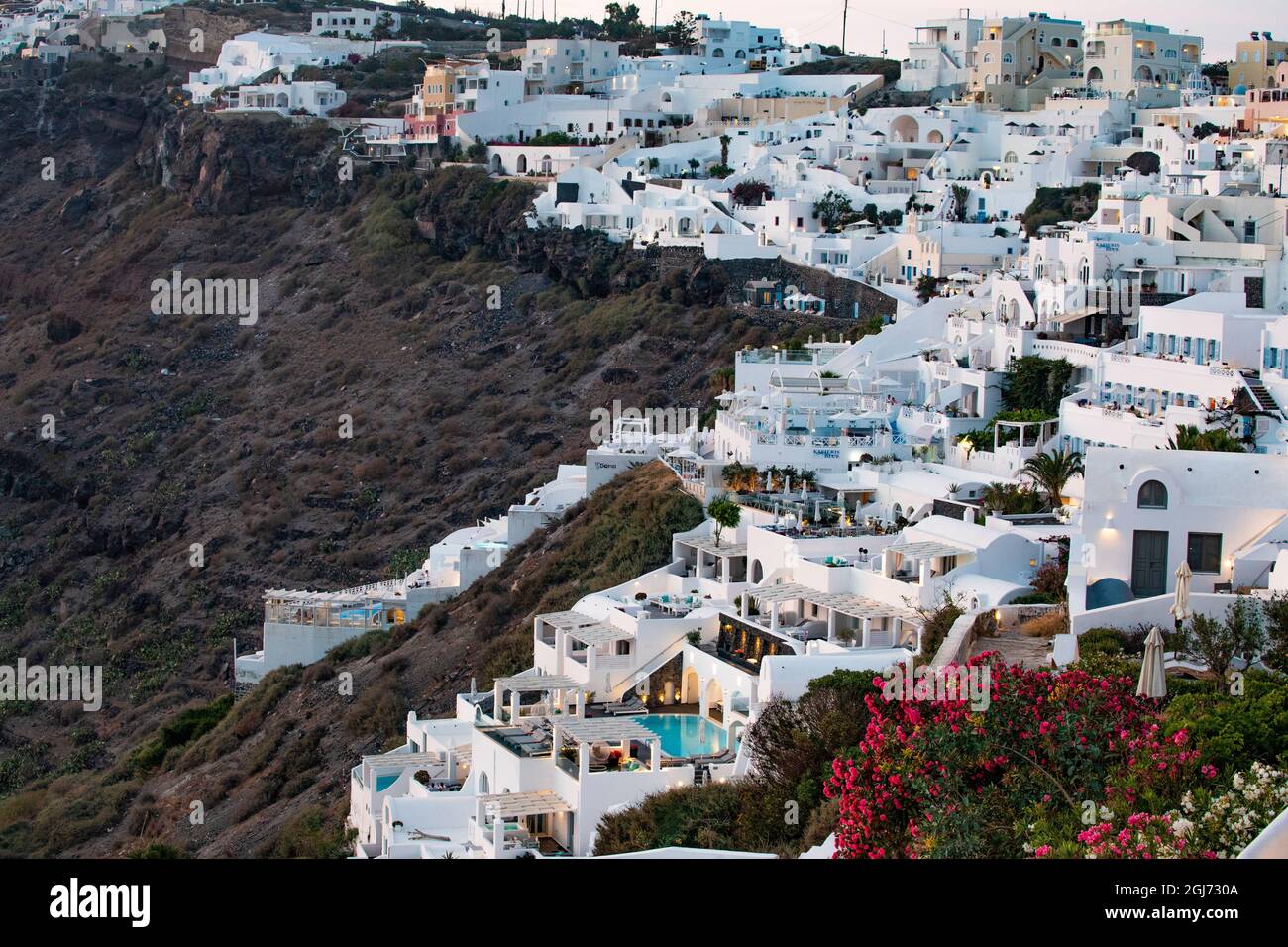 Scenic overlook at sunset of the volcanic caldera at the town of Fira ...