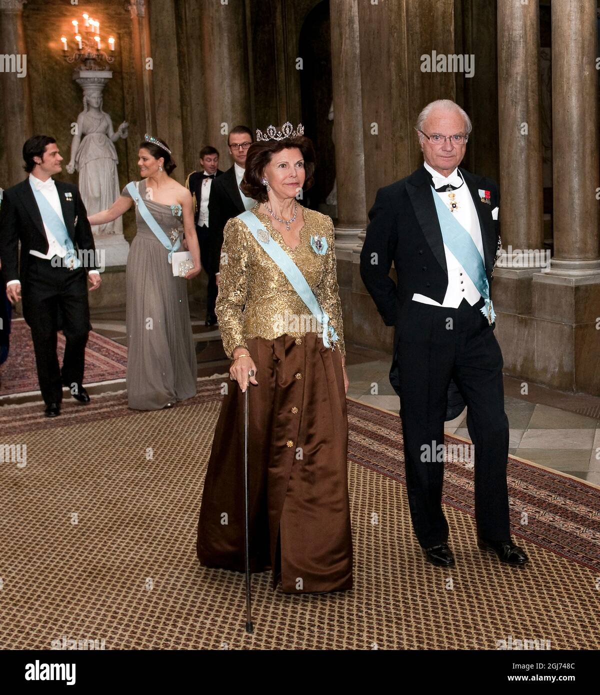 Swedish Queen Silvia and King Carl XVI in front of Prince Carl Philip ...