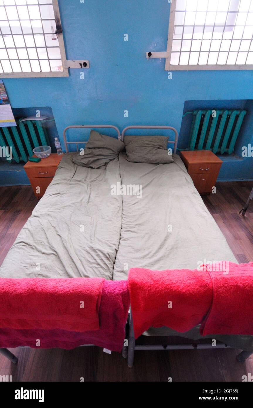 Cell for juvenile offenders: bunks, lockers, tables, benches and pegs ...