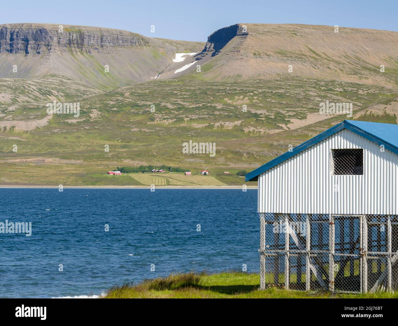 Typical huts for drying fish at the shore of Dyrafjordur fjord. The ...