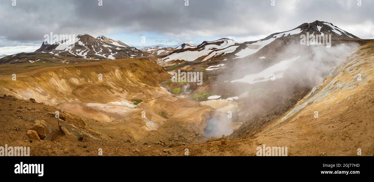 Hikers in the geothermal area of Hveradalir in the mountains of ...
