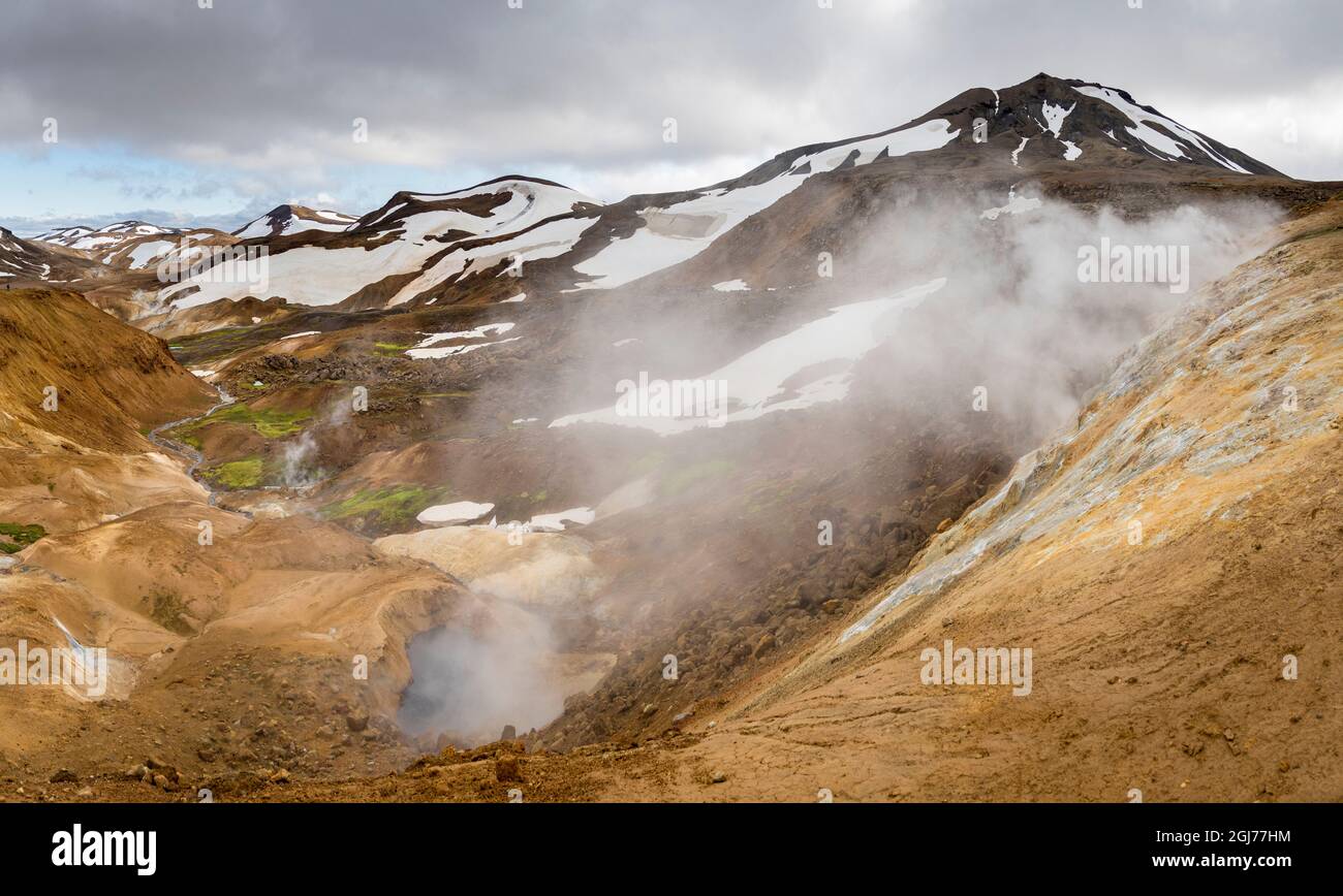 Hikers in the geothermal area of Hveradalir in the mountains of ...