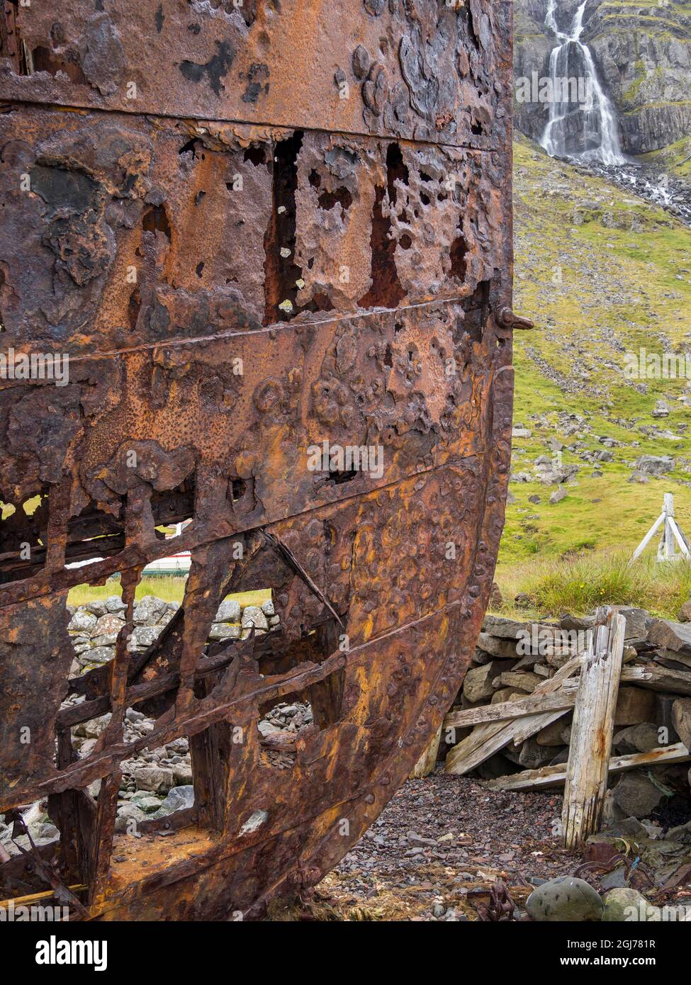 Landscape at Reykjarfjordur. The old fish factory and wreck. The ...