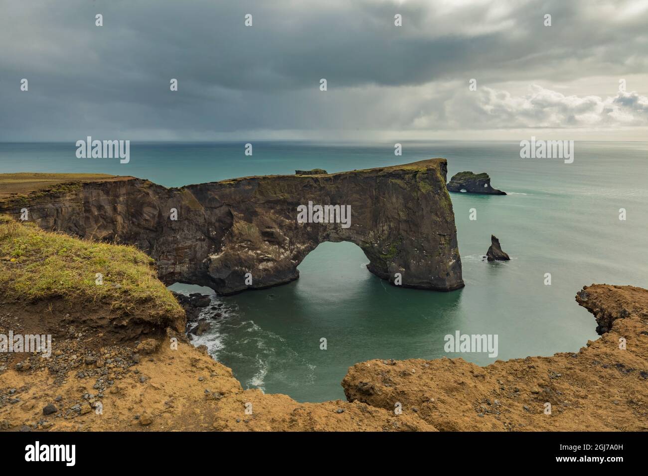 Europe, Iceland. View of arch at Dyrholaey peninsula on the southern ...