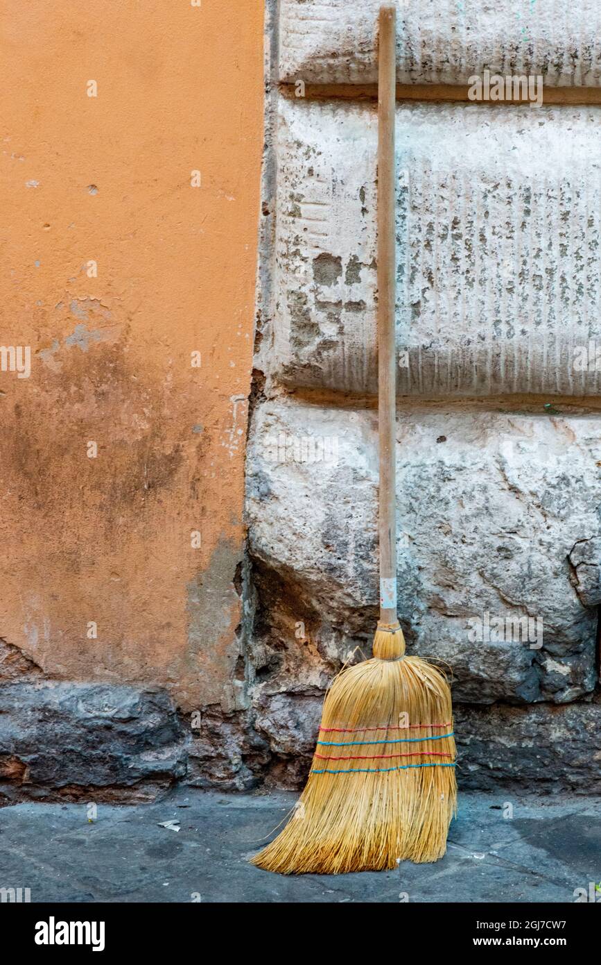 Italy, Rome. Via Ripetta, broom on sidewalk Stock Photo - Alamy