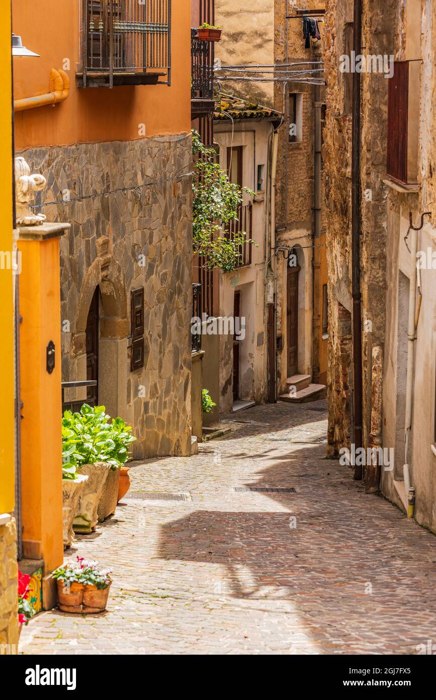 Italy, Sicily, Messina Province, Caronia. A narrow cobblestone street ...