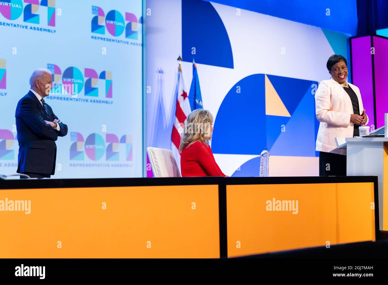 President Joe Biden, Joined by First Lady Jill Biden, listens as ...