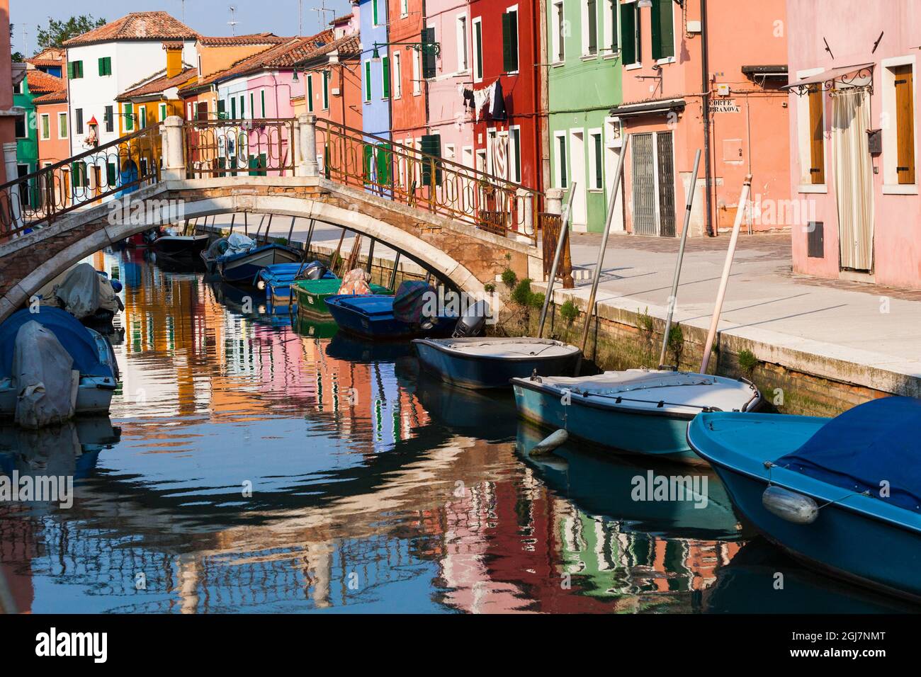 Italy, Burano, reflection of colorful houses in canal Stock Photo - Alamy