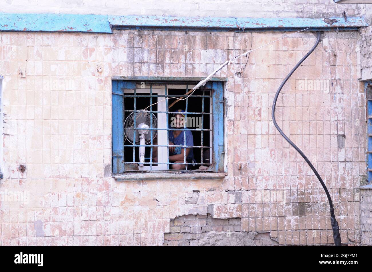 Prisoner looking out through prison bars on the window. Press tour for ...