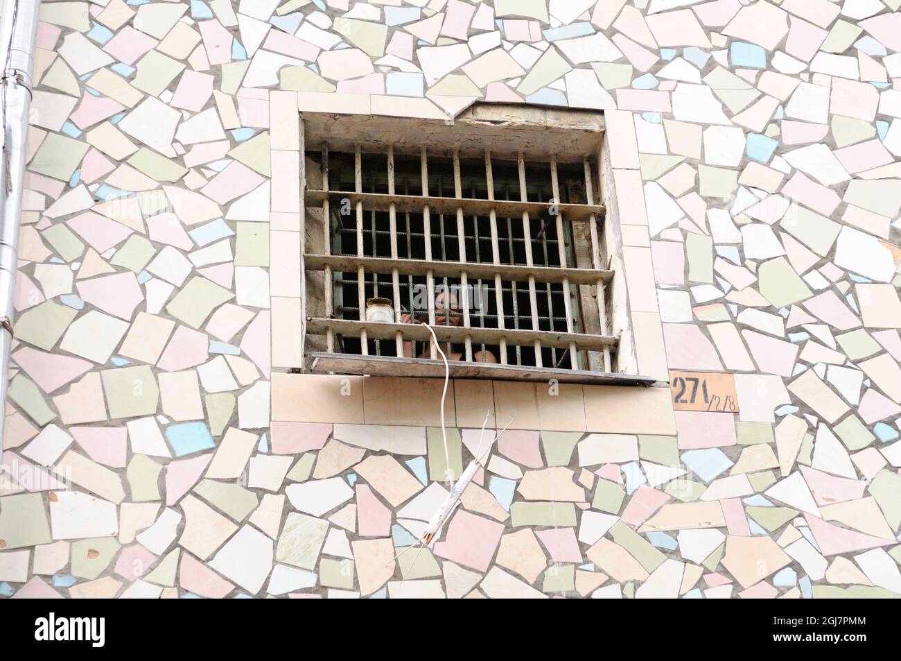 Prisoner looking out through prison bars on the window. Press tour for ...