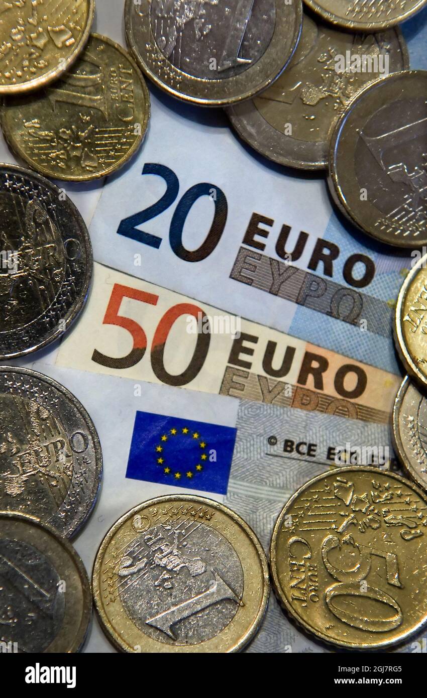 Euros notes and coins Stock Photo - Alamy
