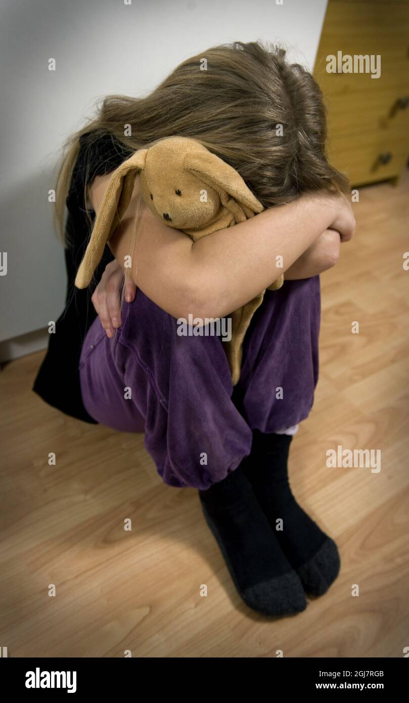A girl crying in with stuffed animal Stock Photo - Alamy