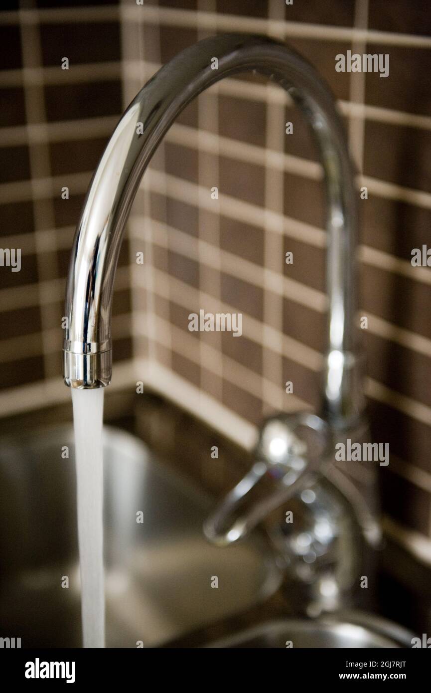Tap with running water Stock Photo - Alamy