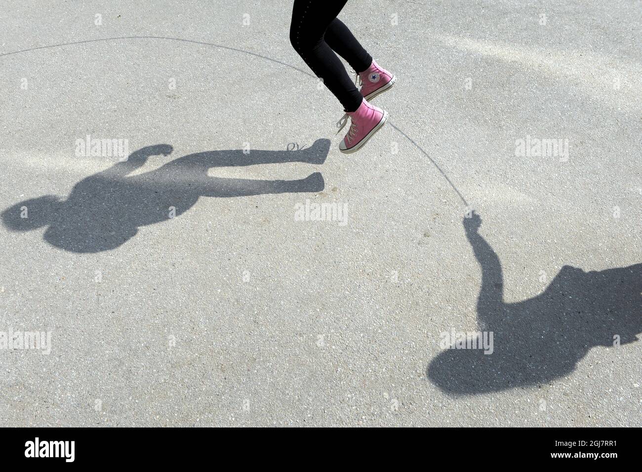 School girls skipping rope at playground Stock Photo - Alamy