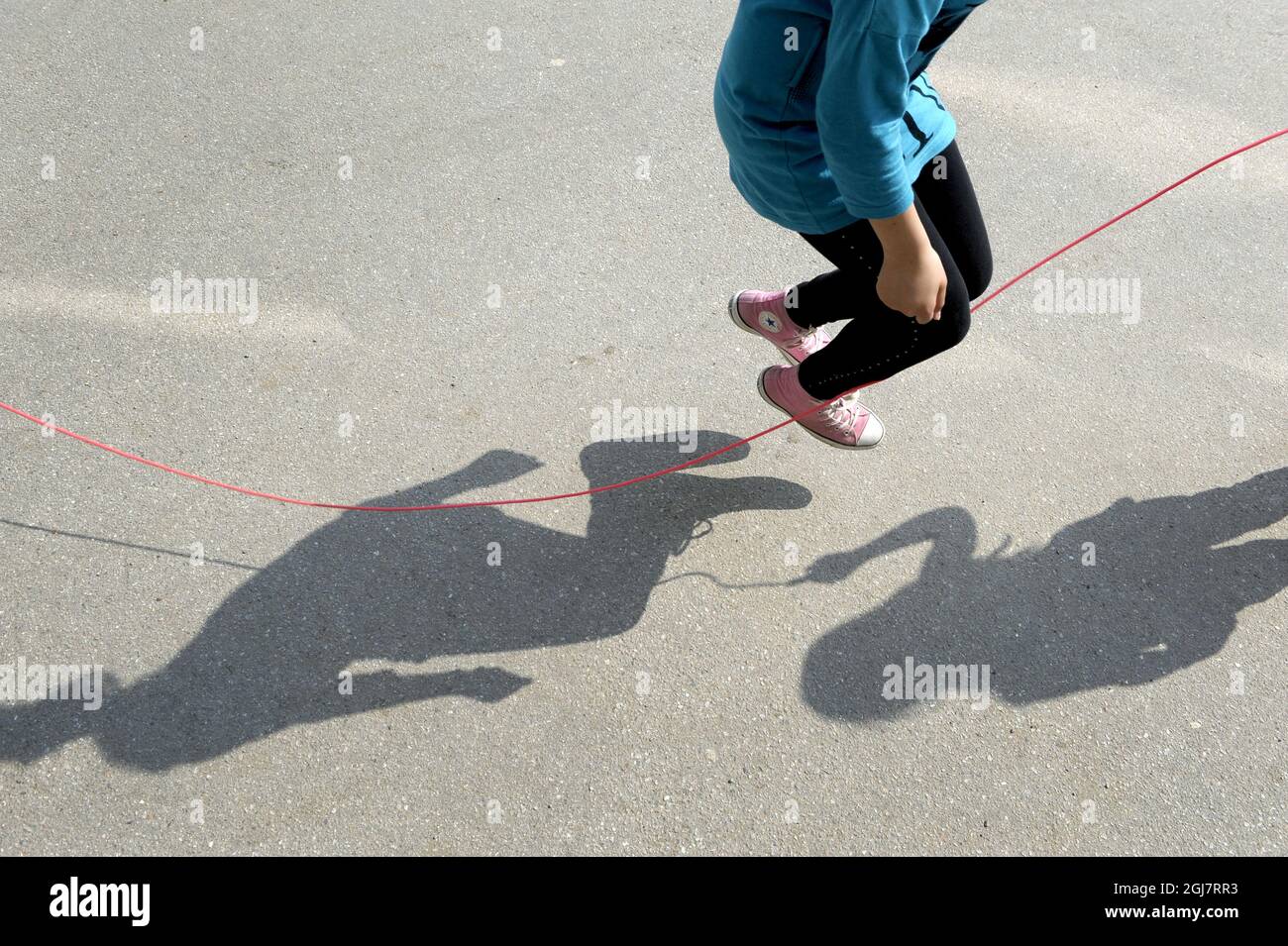 School girls skipping rope at playground Stock Photo - Alamy