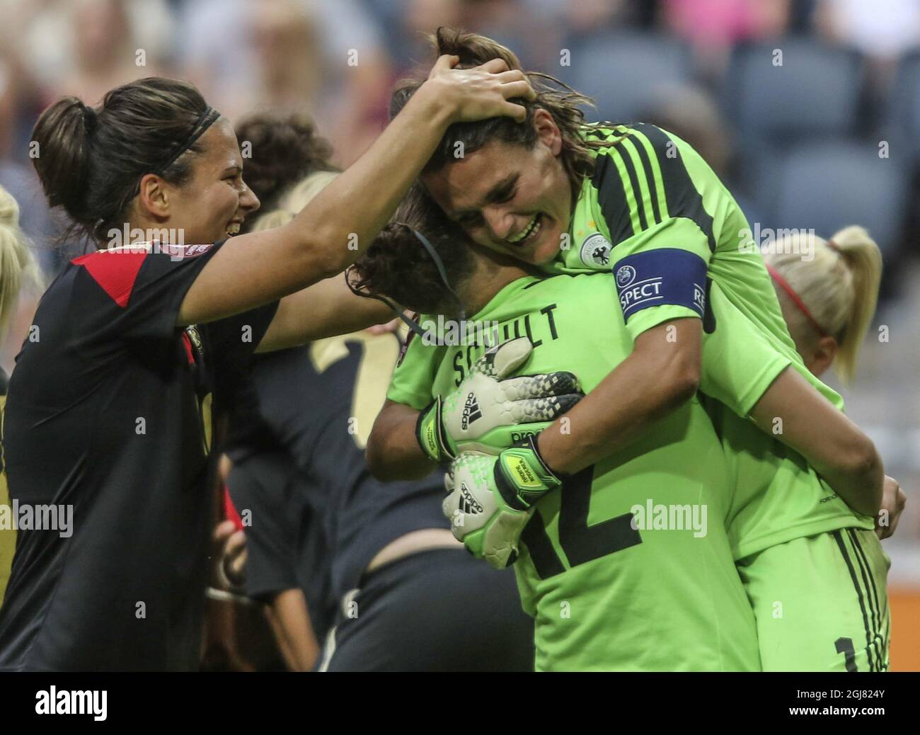 Germany's goalie Nadine Angerer, right, embraces their back-up goalie ...