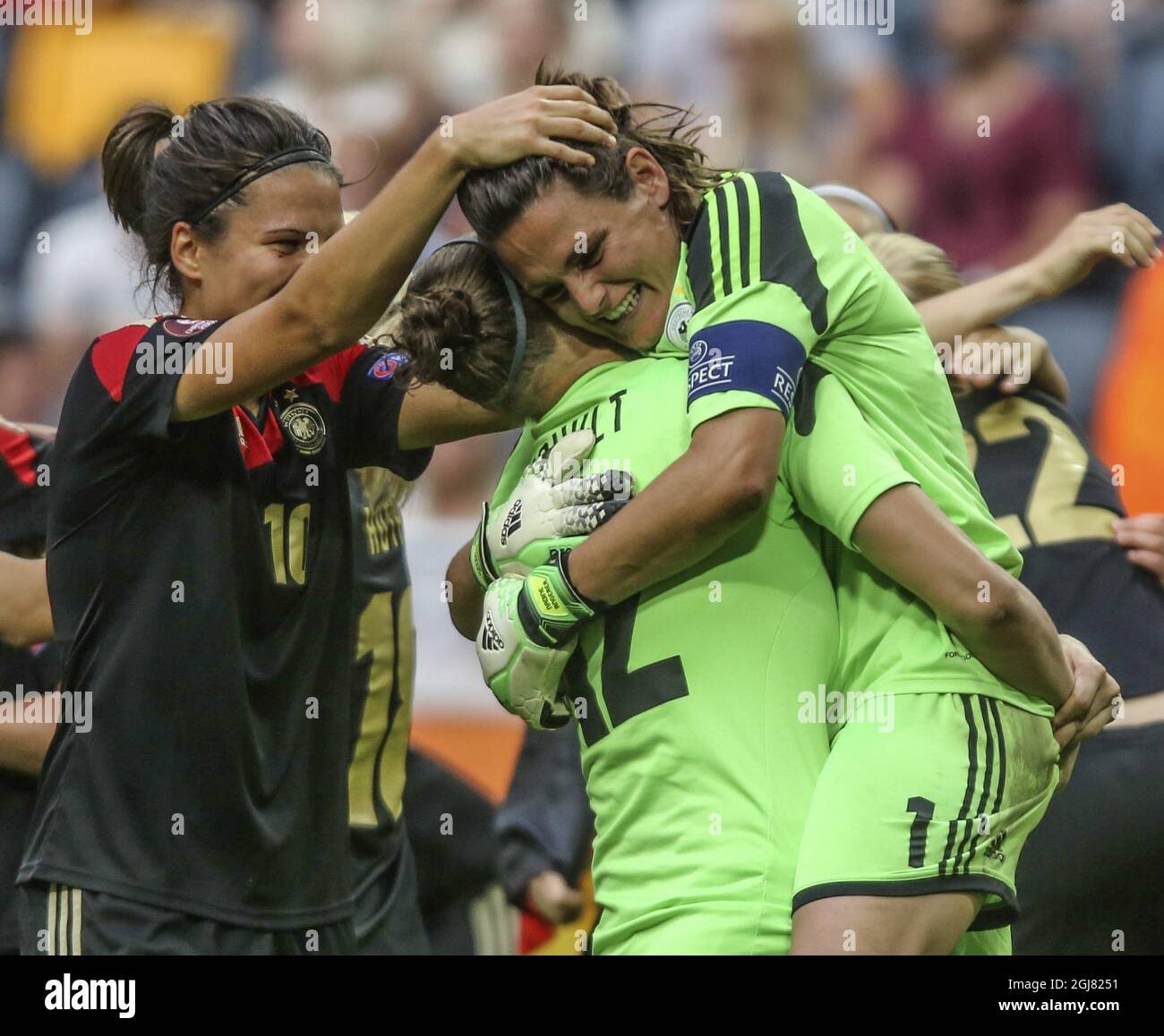 Germany's goalie Nadine Angerer, right, embraces their back-up goalie ...