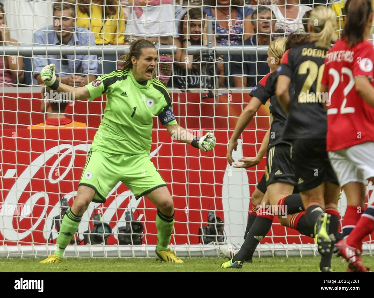 Germany's goalie Nadine Angerer, left, reacts to team mates at Friend's ...