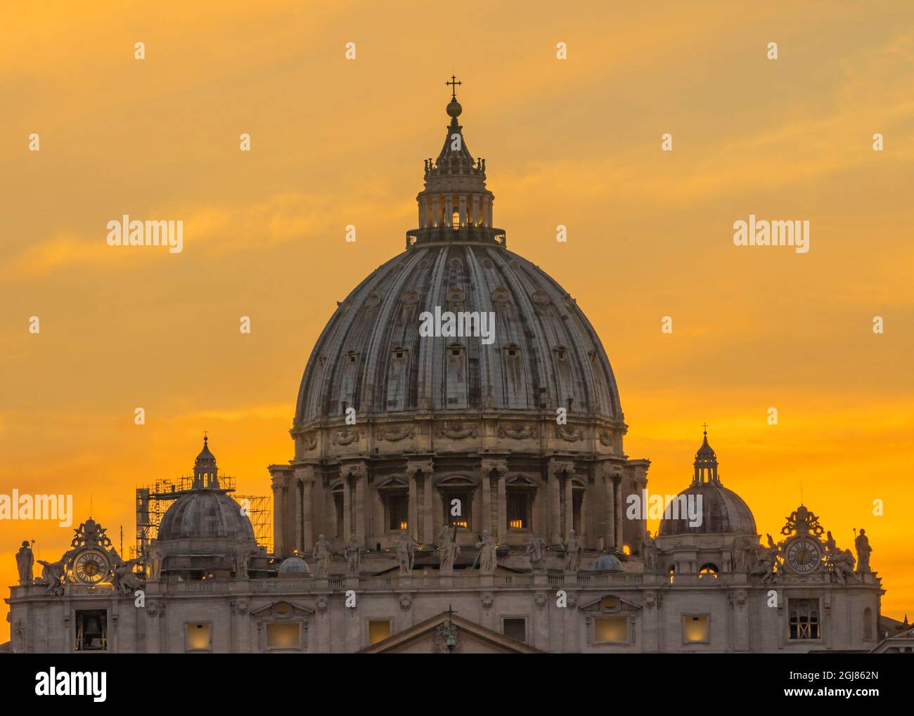 Orange sunset and illuminated streetlights. Via della Conciliazione ...