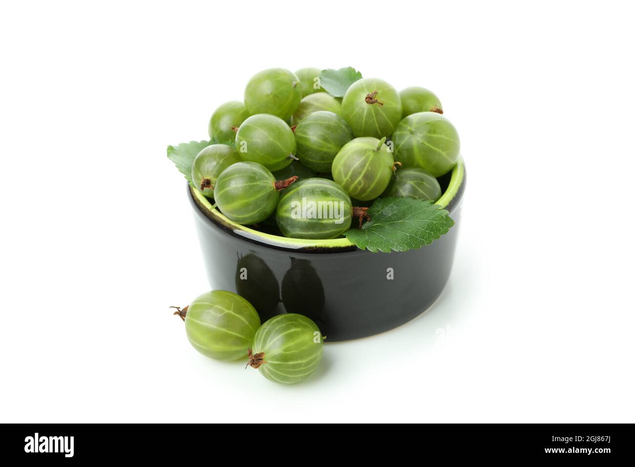Bowl of ripe gooseberry isolated on white background Stock Photo - Alamy