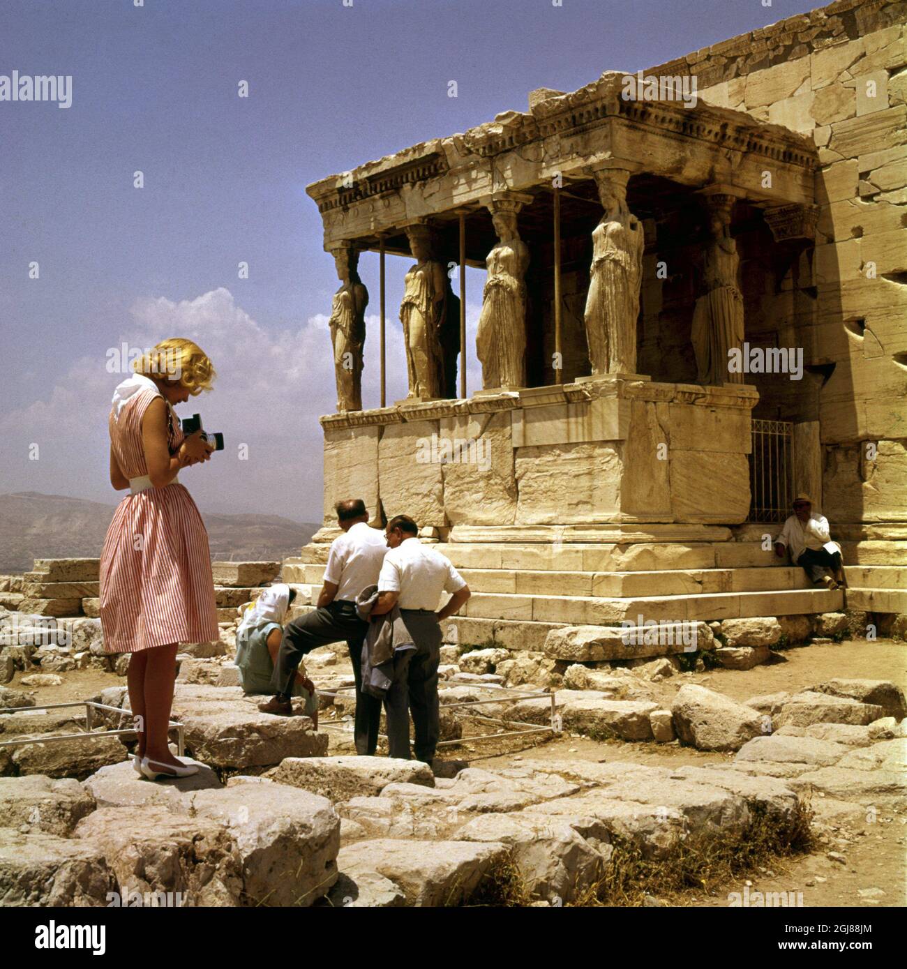 ATHENS; GREECE Photography Date: 196? -? -? FILE A woman taking photos ...