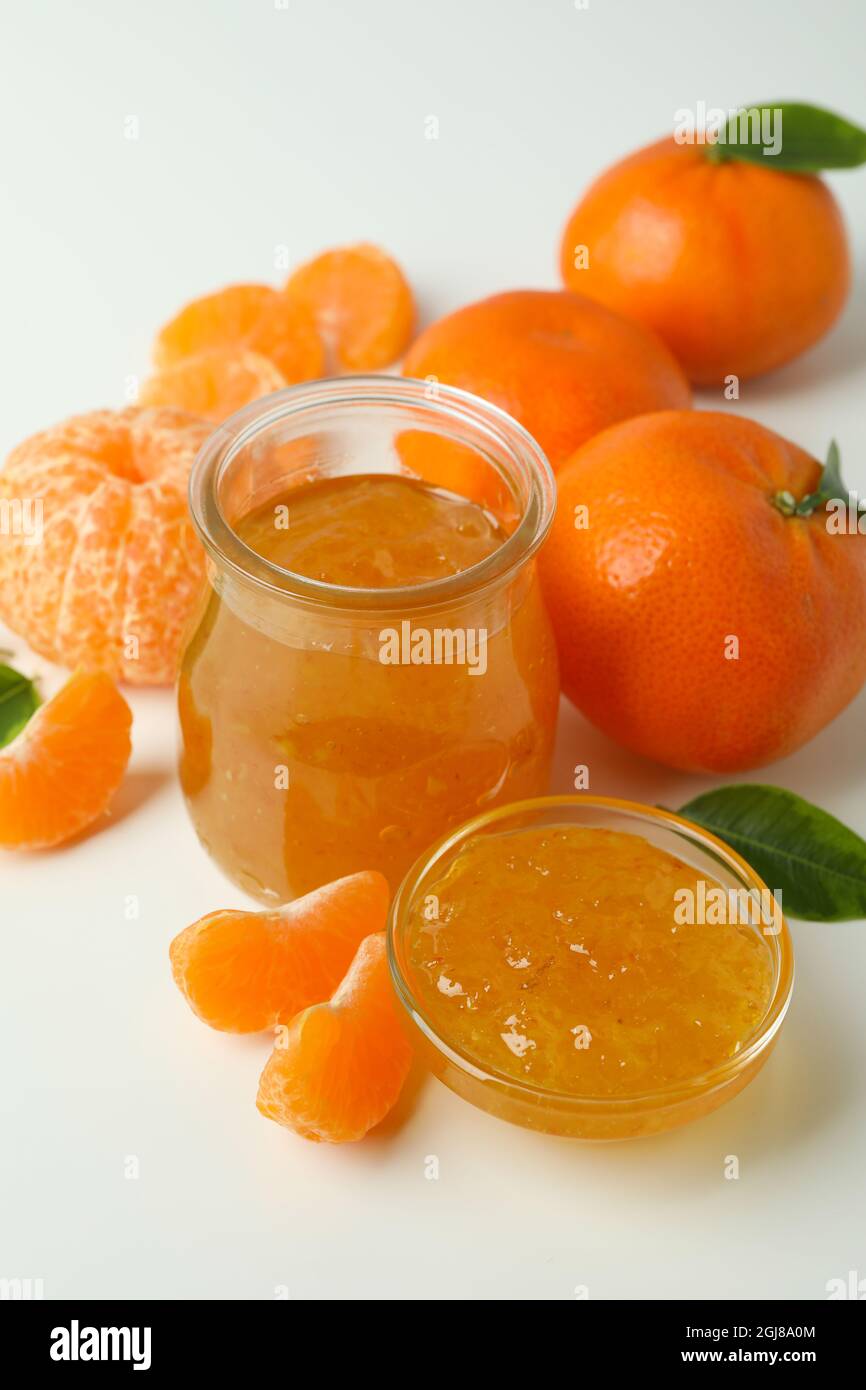 Mandarin jam and ingredients on white background Stock Photo - Alamy