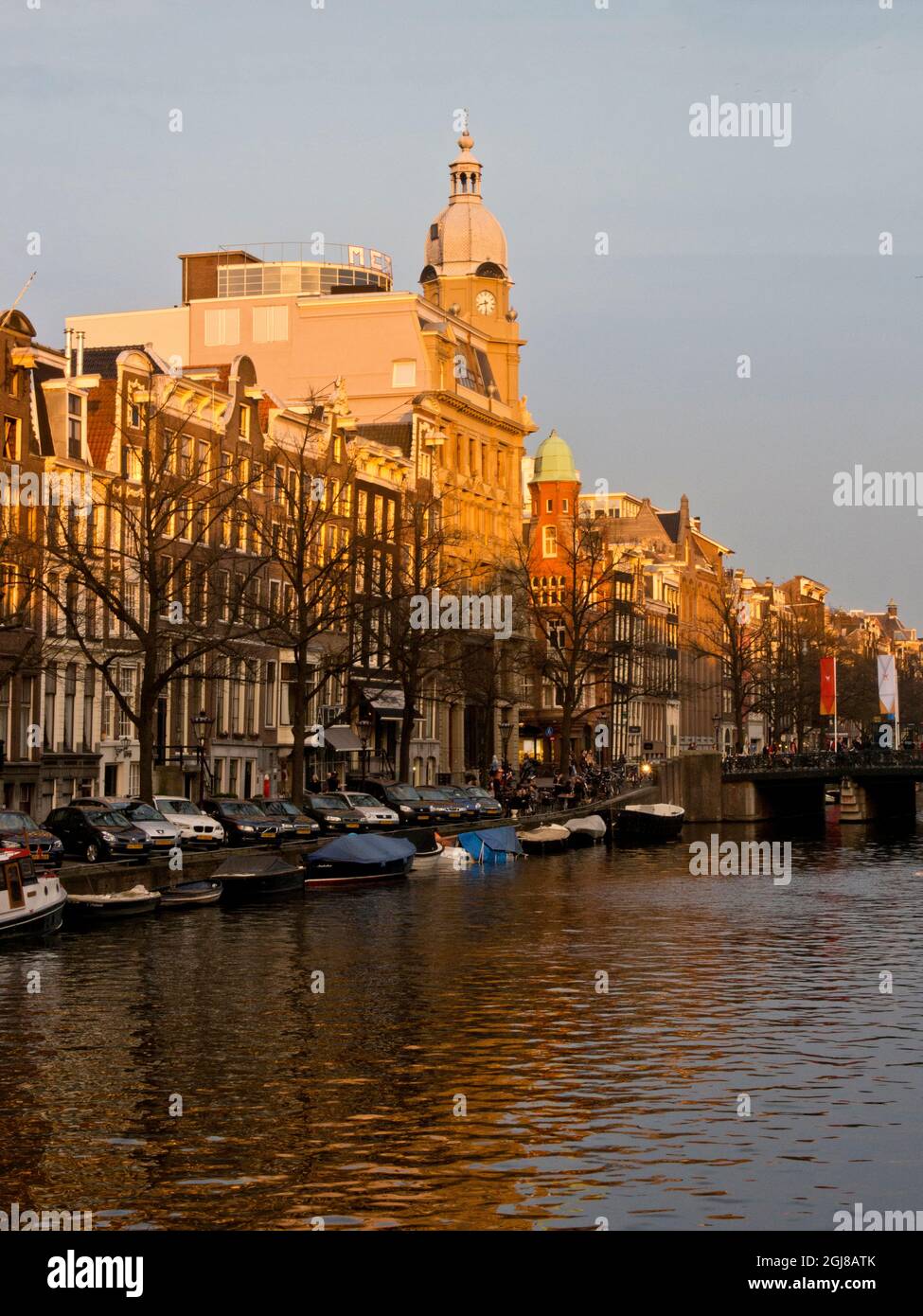 Netherlands, Amsterdam. Clock tower on historic building along the ...