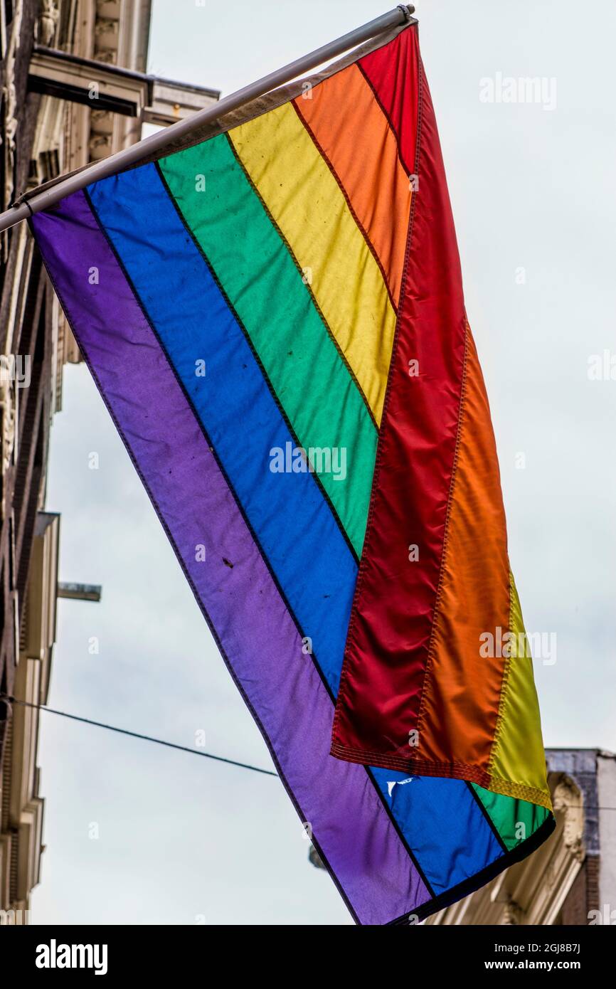 Pride flag on Warmoesstraat red light, Amsterdam, Holland, Netherlands ...