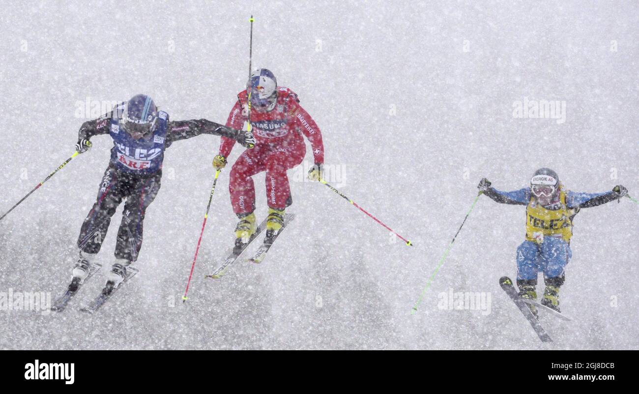Winner Switzerland's Fanny Smith, middle, in action through heavy ...