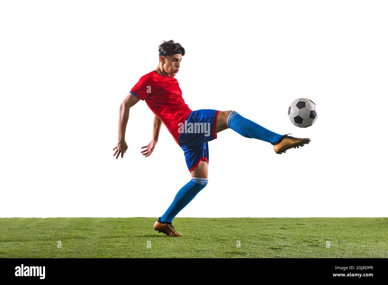 Young man, male soccer football player training isolated on white ...