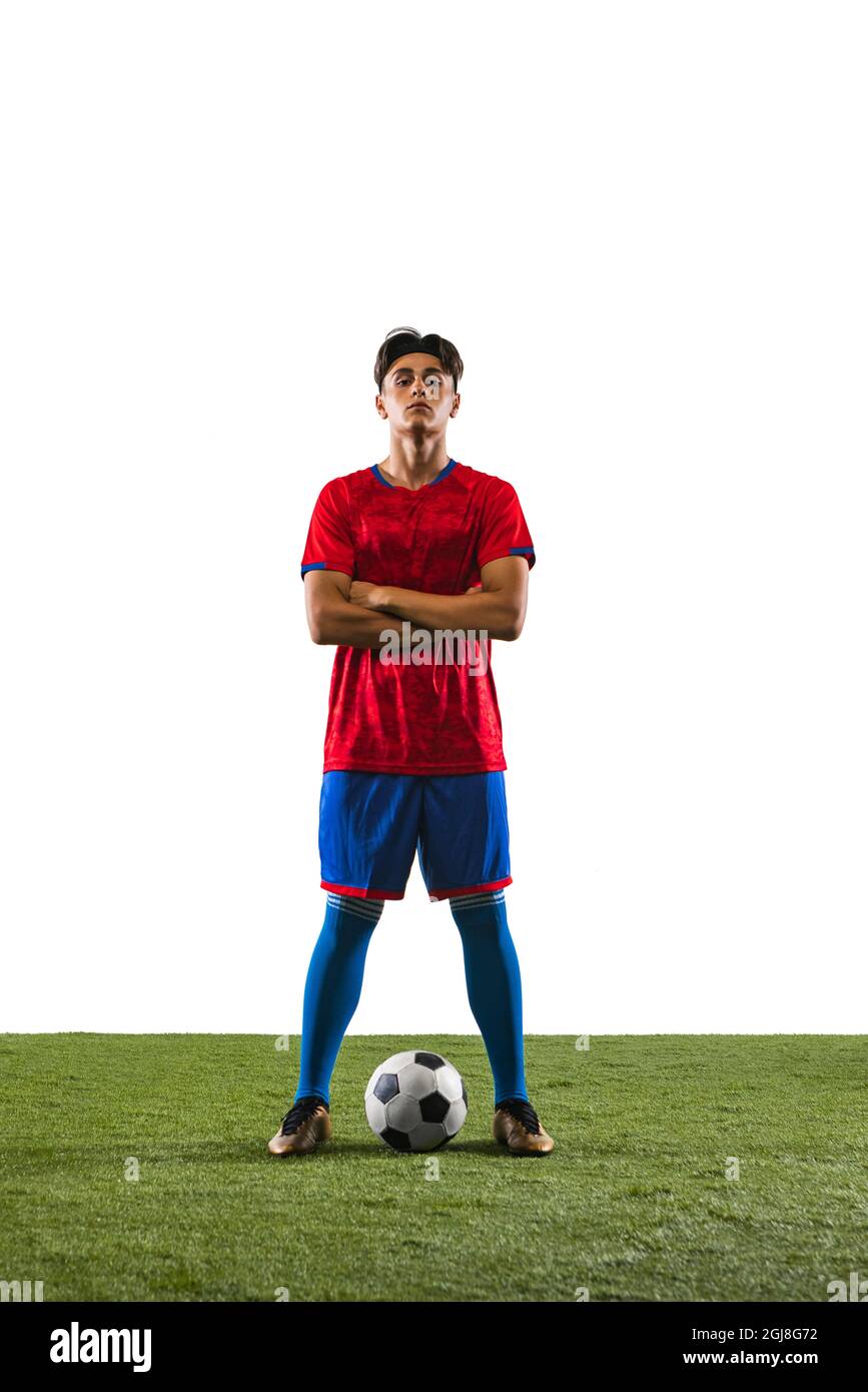 Full-length vertical portrait of young male soccer football player ...