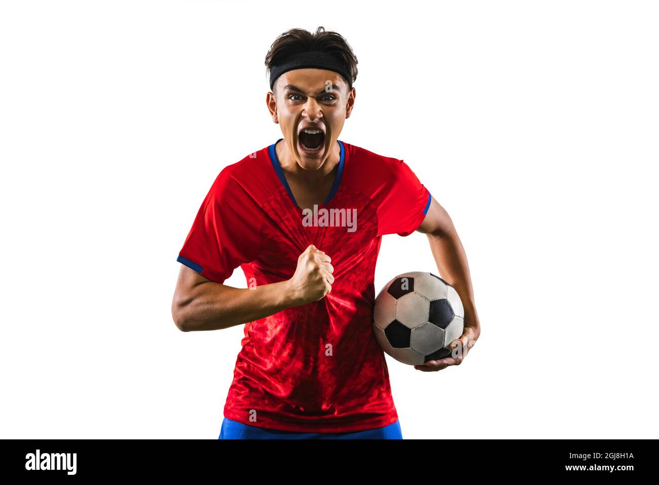 One excited young soccer football player isolated over white background ...