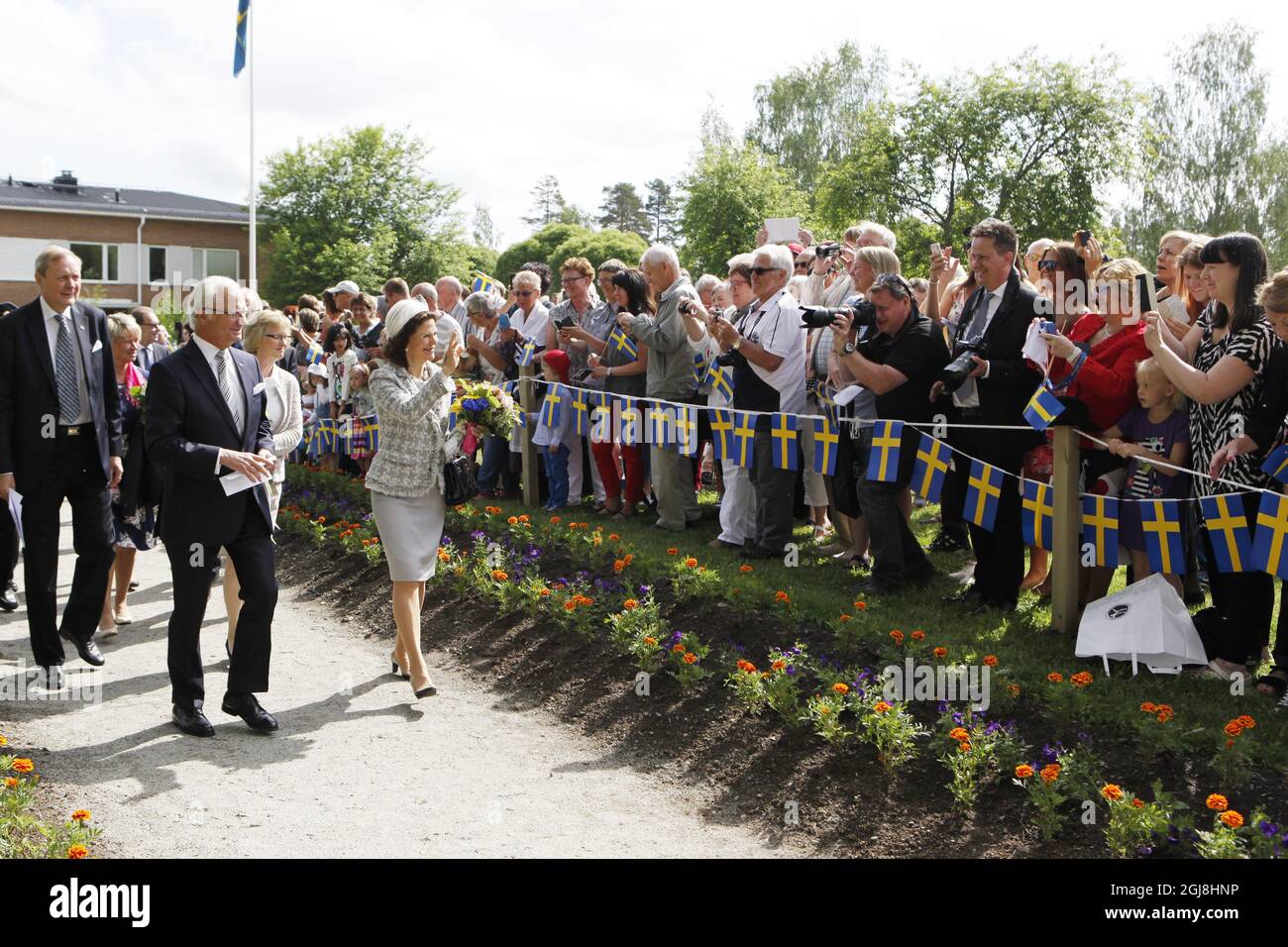 ANGE 20140606 Queen Silvia and King Carl XVI Gustaf are welcomed by the ...