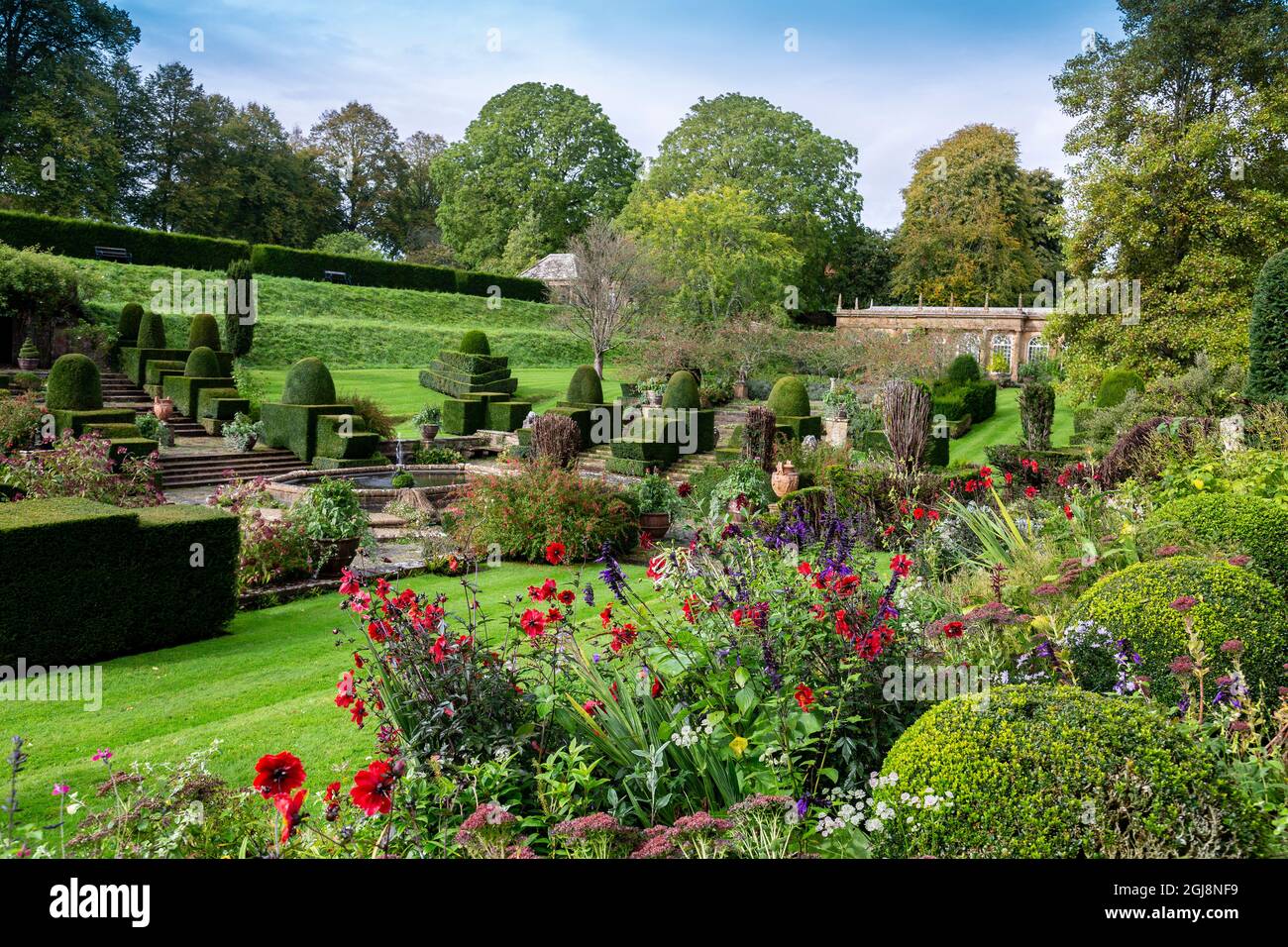 The colourful borders and topiary in the italianate Fountain Court ...