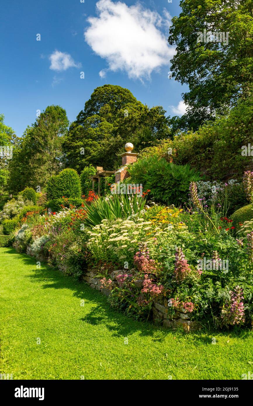 The colourful herbaceous borders in the italianate Fountain Court ...