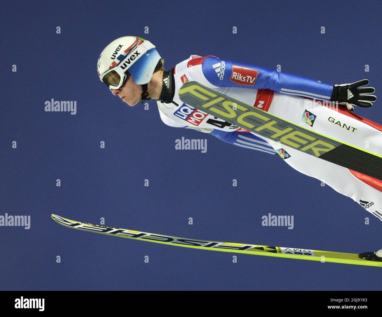 Rune Velta of Norway soars through the air the mens' normal hill ...