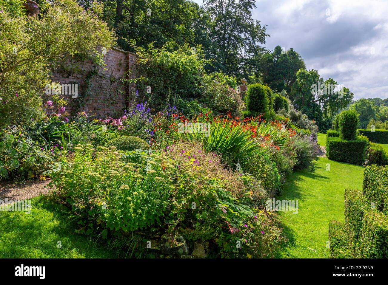 The colourful borders and topiary in the italianate Fountain Court ...