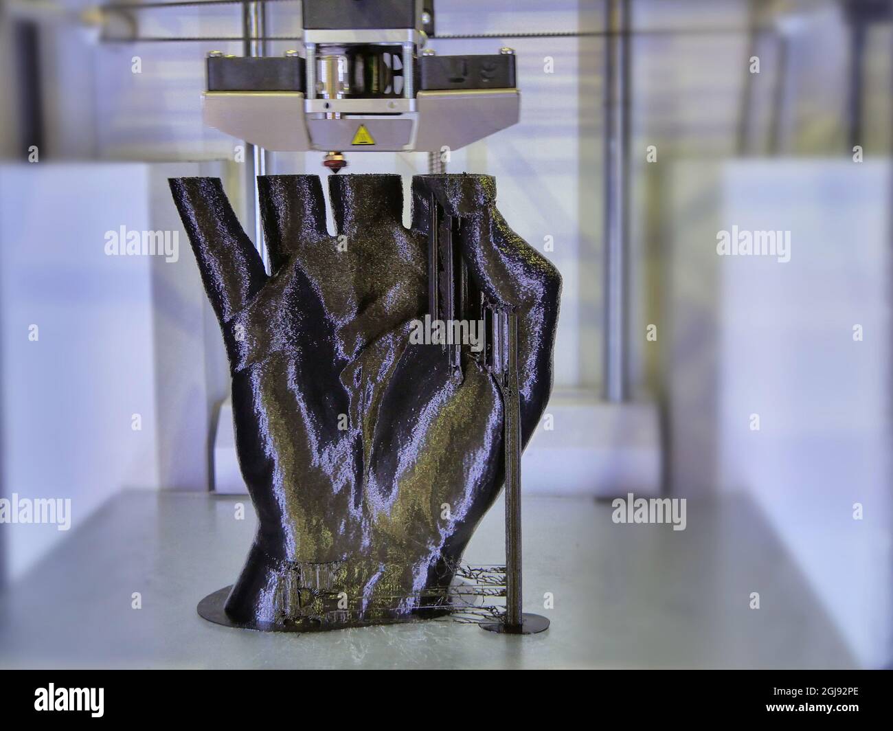 3D printer generating a black human hand Stock Photo - Alamy