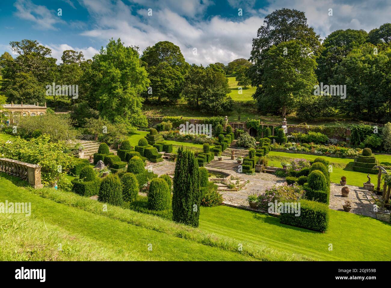 The colourful borders and topiary in the italianate Fountain Court ...
