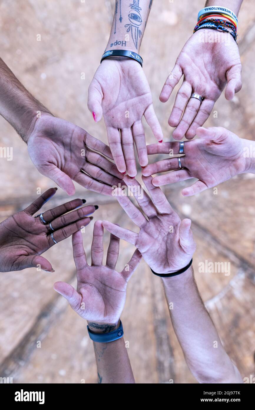 Top view of young people folding their hands together Stock Photo - Alamy